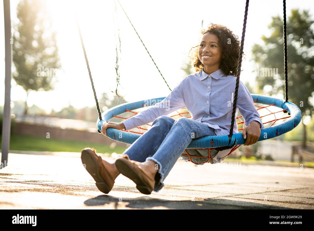 Cinematic image of children playing at the playground Stock Photo - Alamy