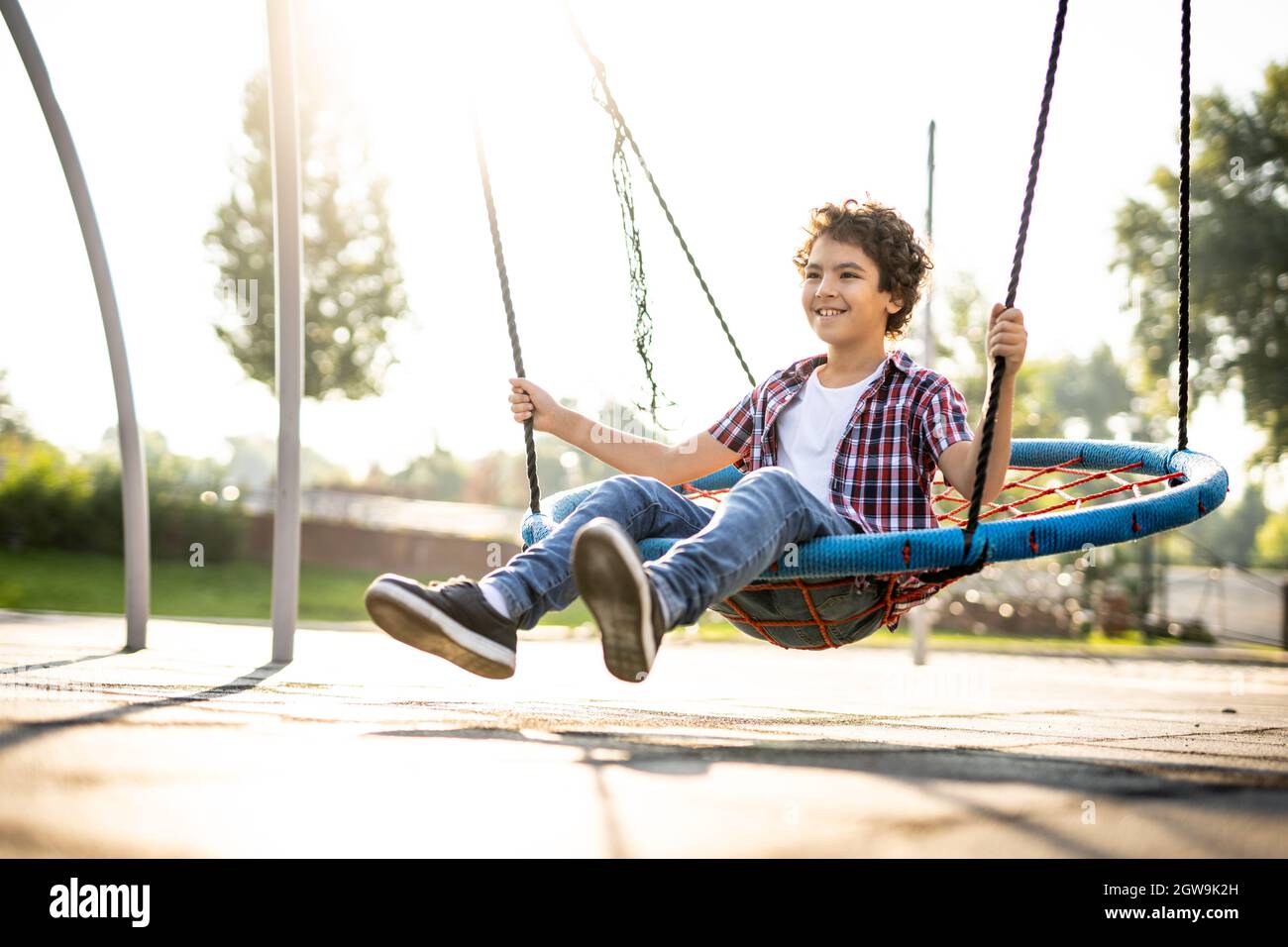 cinematic image of children playing at the playground Stock Photo - Alamy