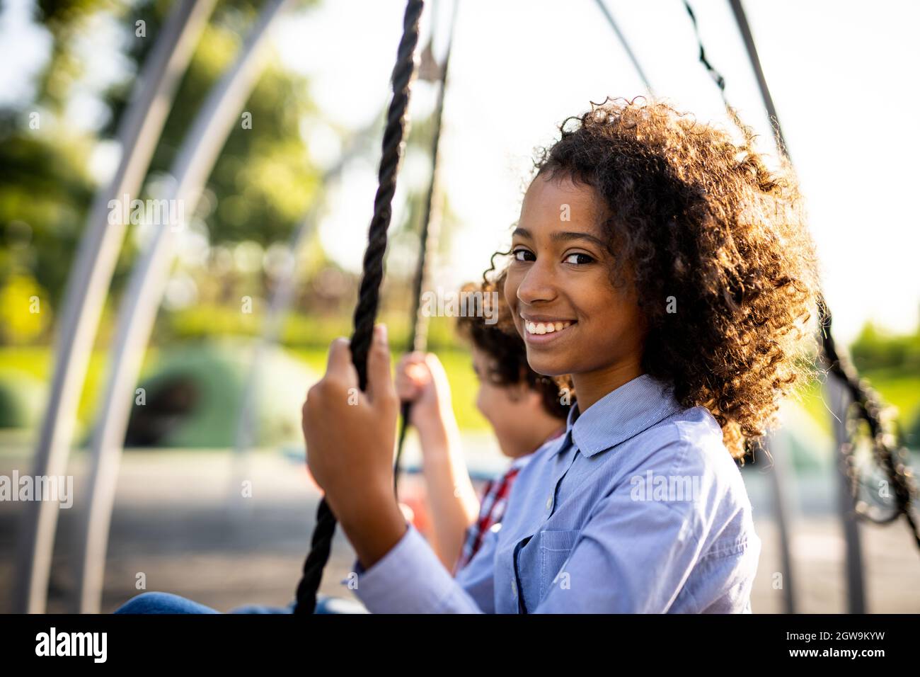 Cinematic image of children playing at the playground Stock Photo - Alamy