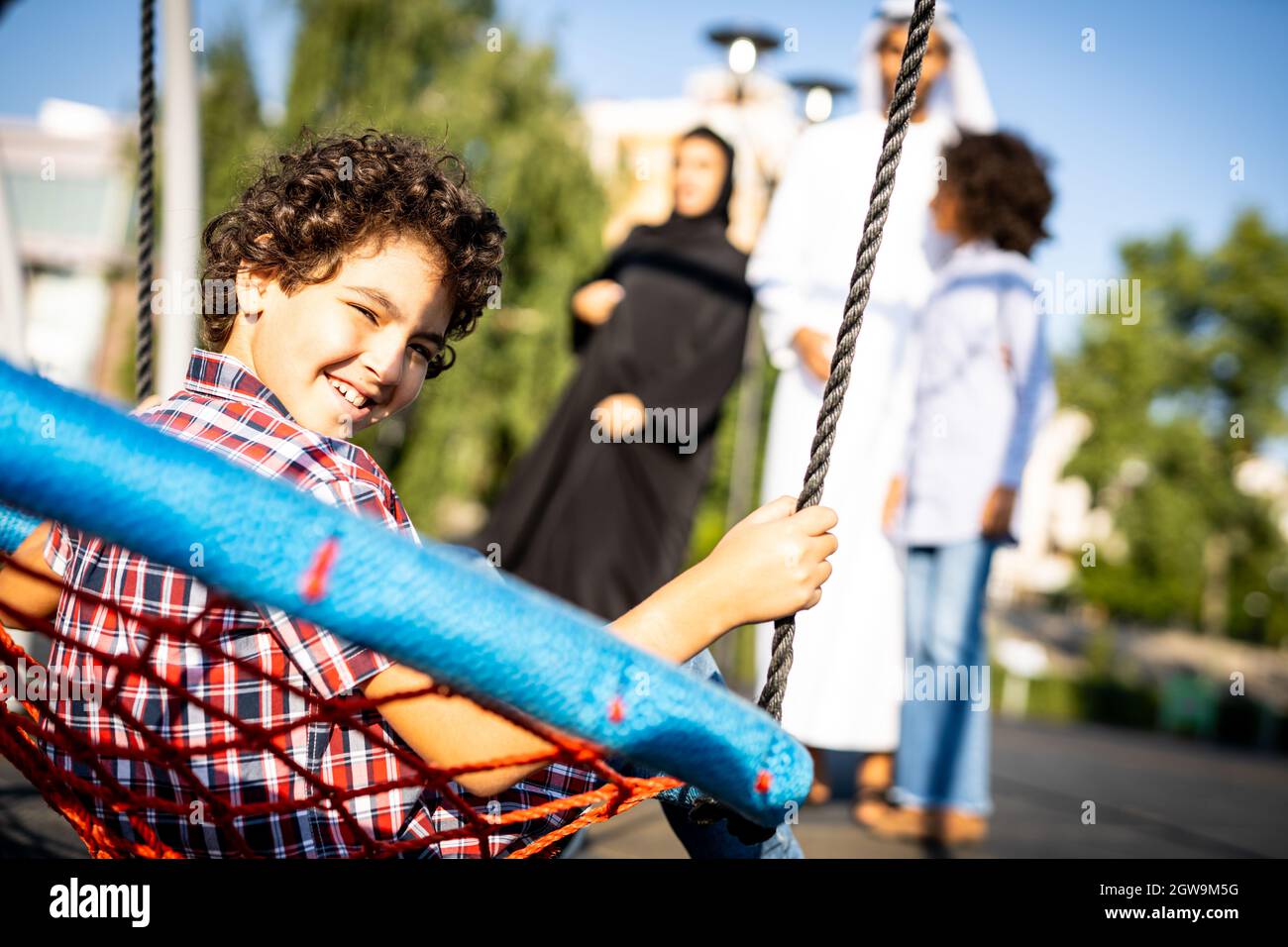 Cinematic image of a family playing at the playground in Dubai Stock ...