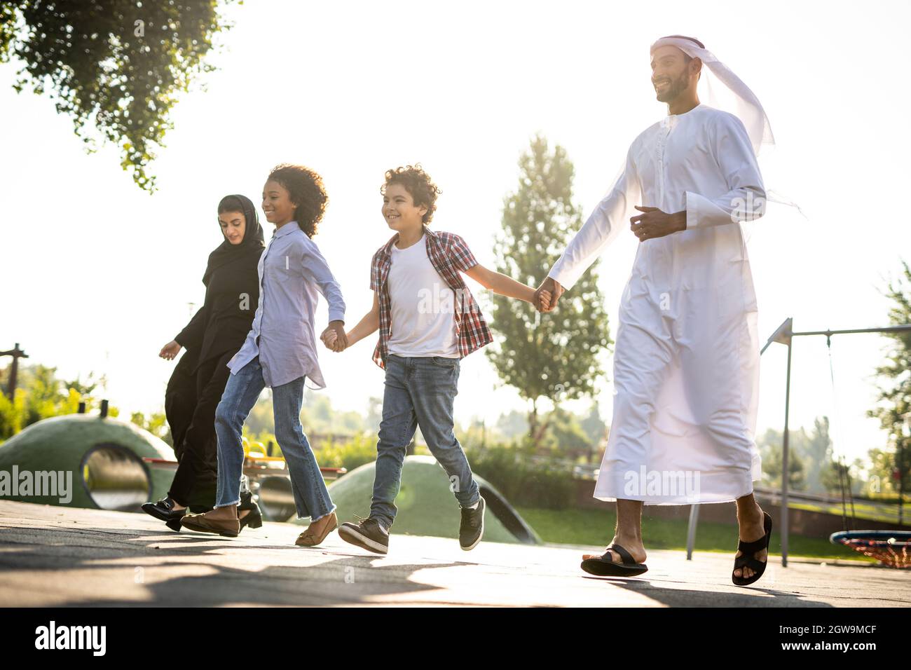 Cinematic image of a family playing at the playground in Dubai Stock ...