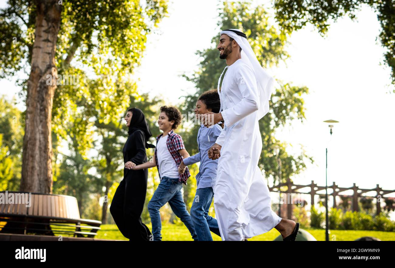 Cinematic image of a family playing at the playground in Dubai Stock ...