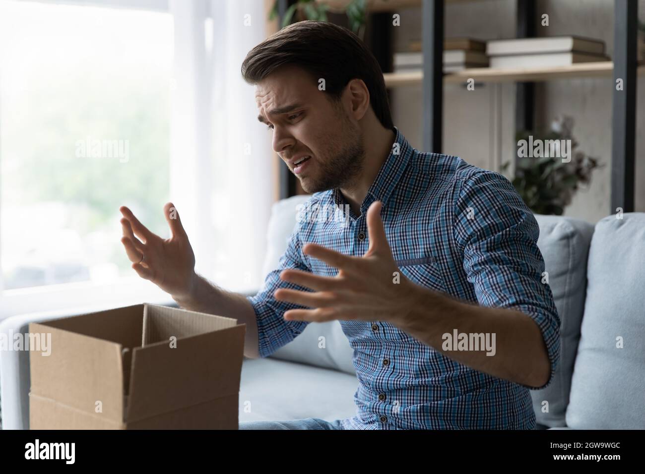 Unhappy man frustrated by wrong order, bad delivery service Stock Photo ...
