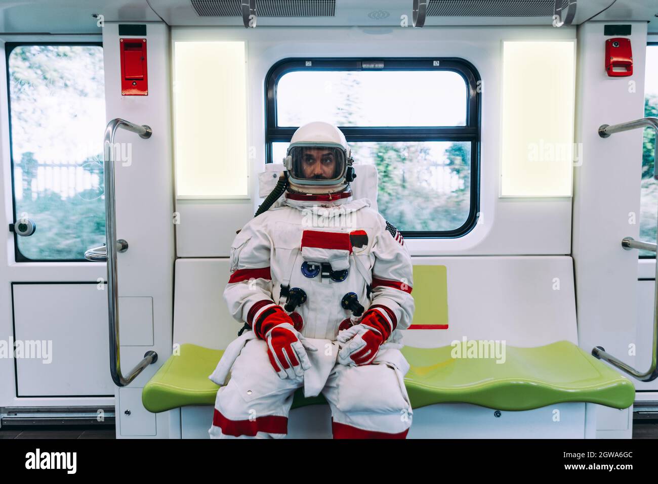 spaceman in a futuristic station. Man with space suit leaving for work ...