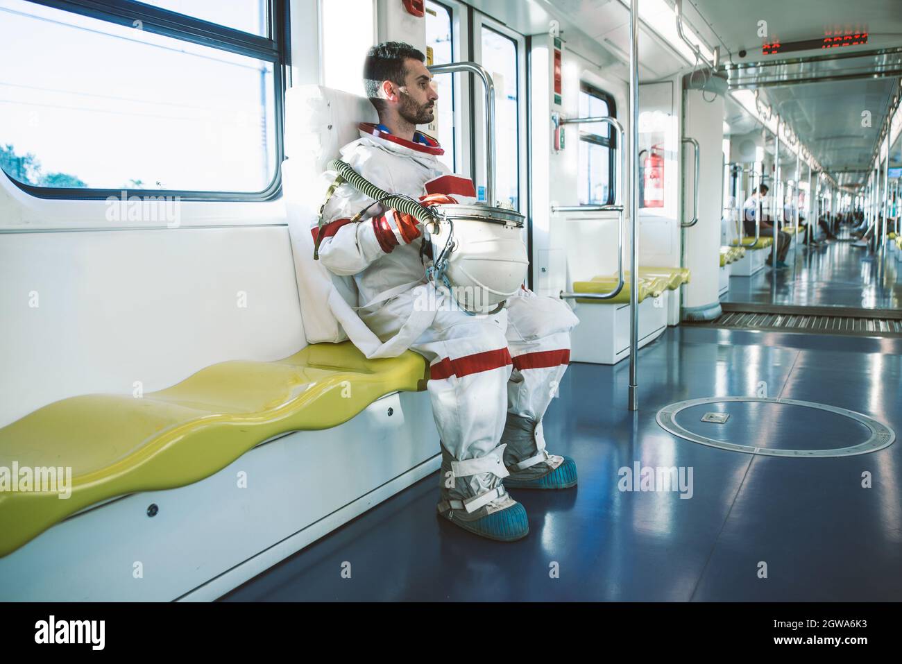 spaceman in a futuristic station. Man with space suit leaving for work ...