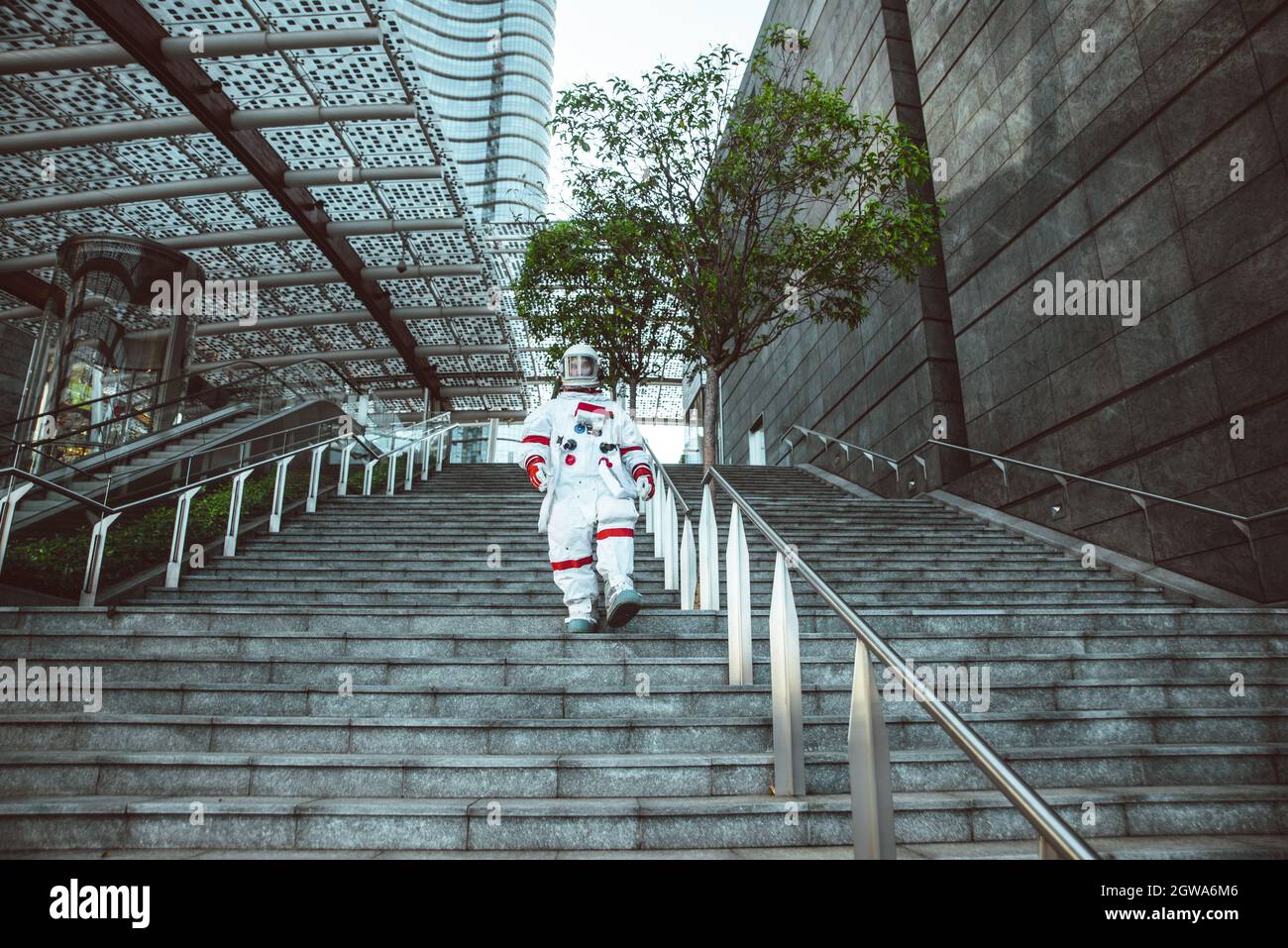spaceman in a futuristic station. Man with space suit walking in an ...
