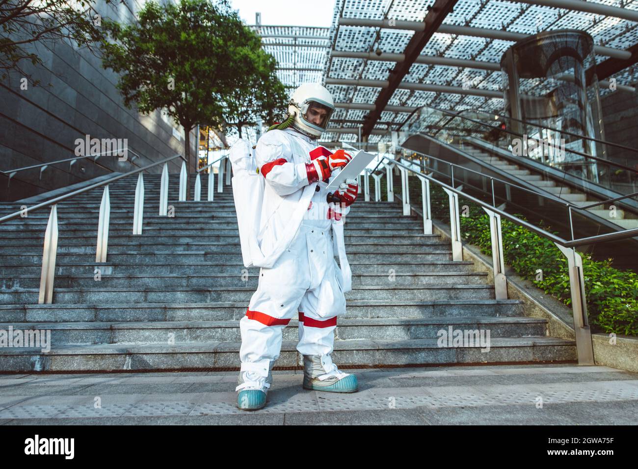 spaceman in a futuristic station. Man with space suit walking in an ...