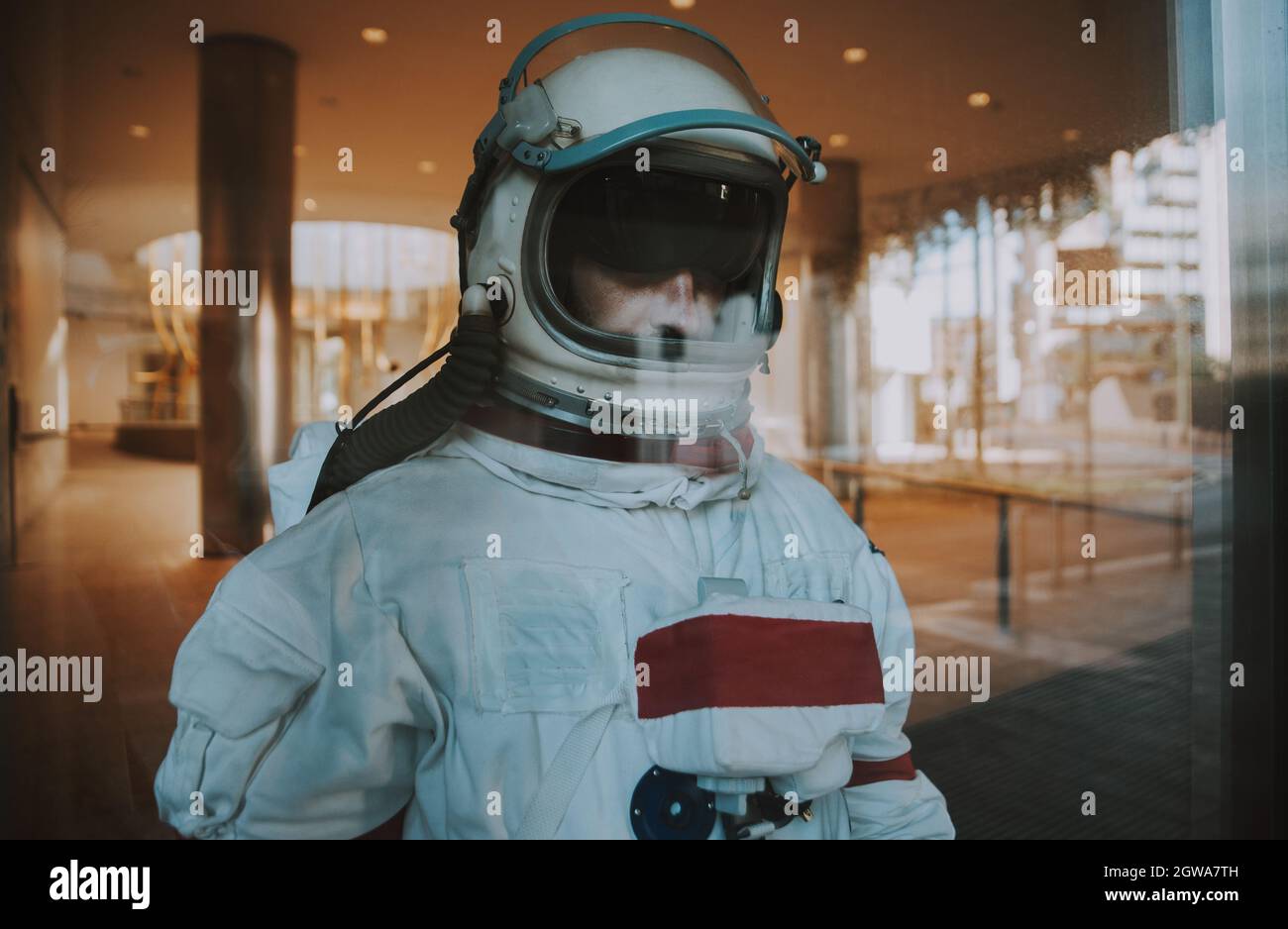 spaceman in a futuristic station. Man with space suit walking in an ...