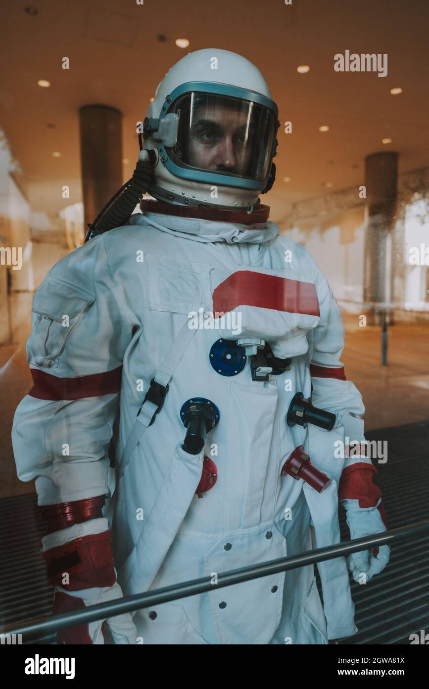 spaceman in a futuristic station. Man with space suit walking in an ...