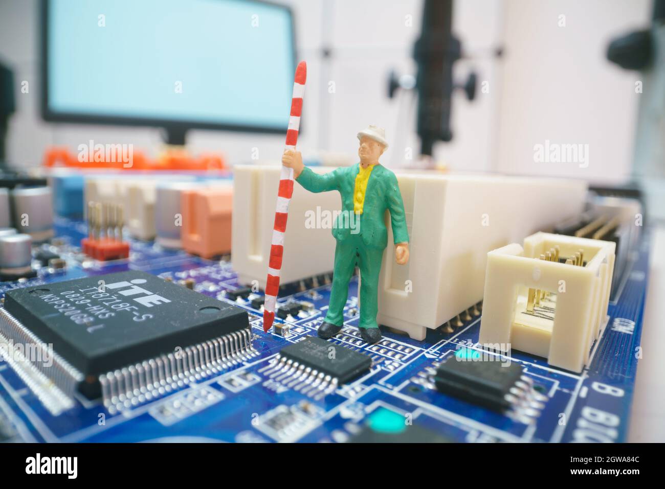 Miniature repair man on mainboard, Miniature figure of worker team try ...
