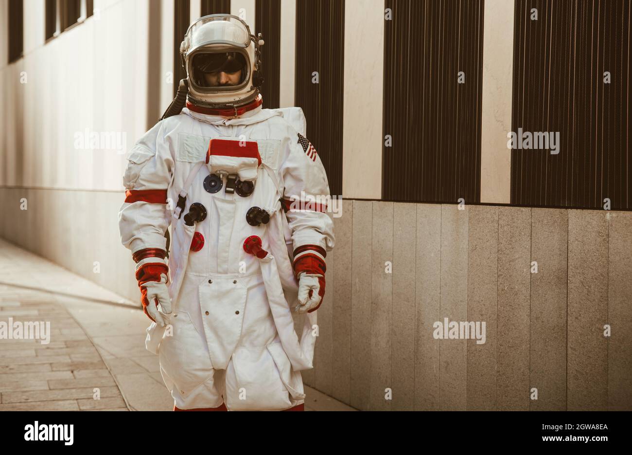 Spaceman in a futuristic station. Man with space suit walking in an ...