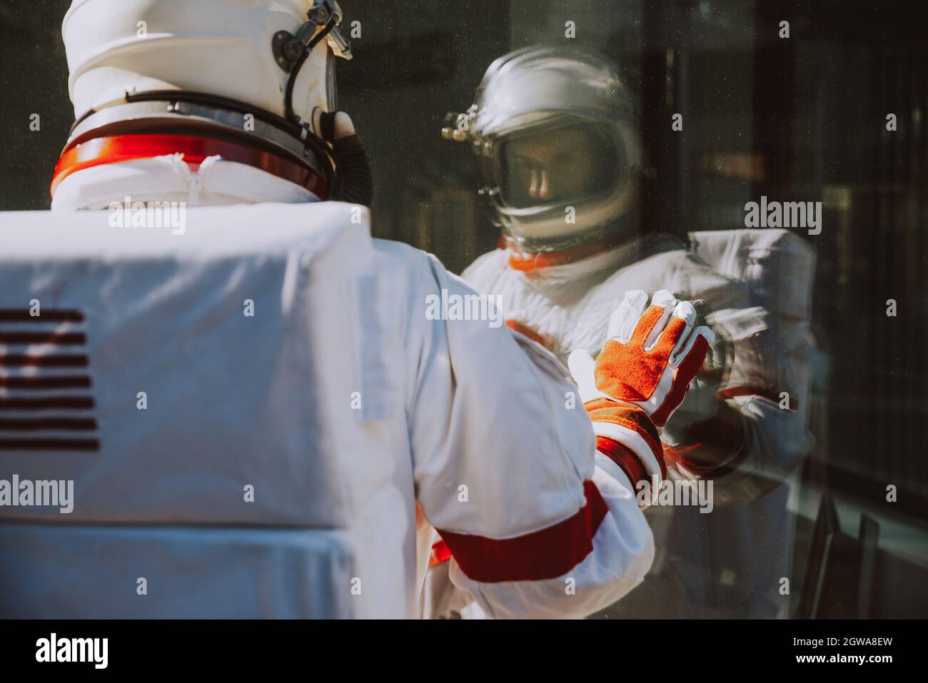 spaceman in a futuristic station. Man with space suit walking in an ...
