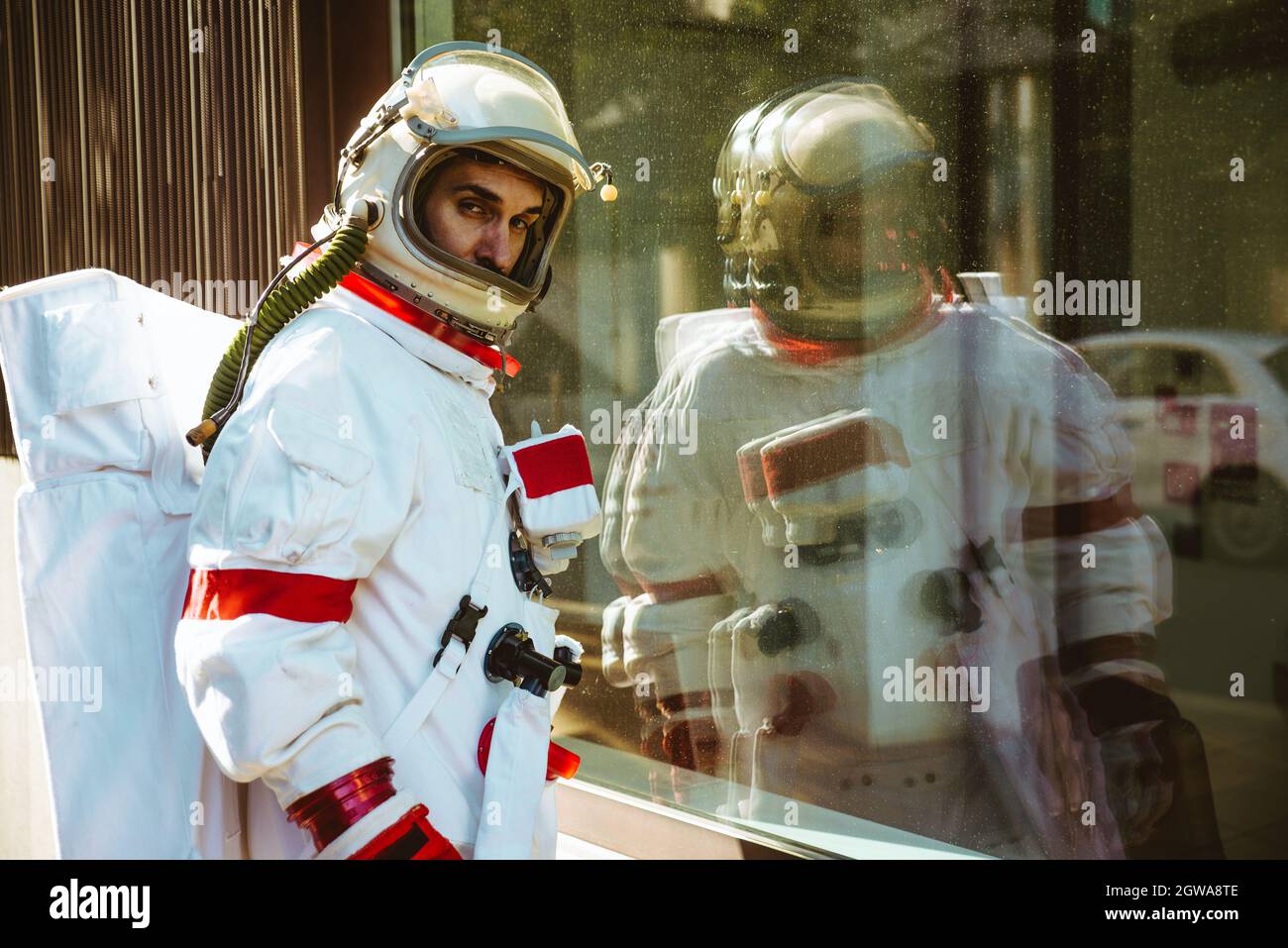 spaceman in a futuristic station. Man with space suit walking in an ...