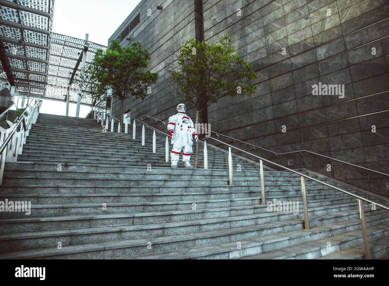 spaceman in a futuristic station. Man with space suit walking in an ...