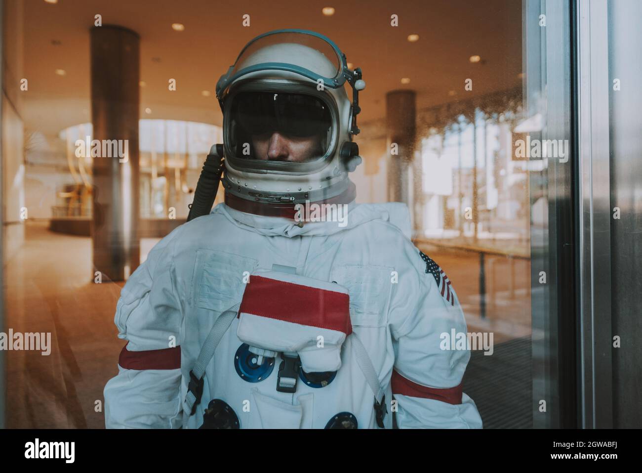 spaceman in a futuristic station. Man with space suit walking in an ...