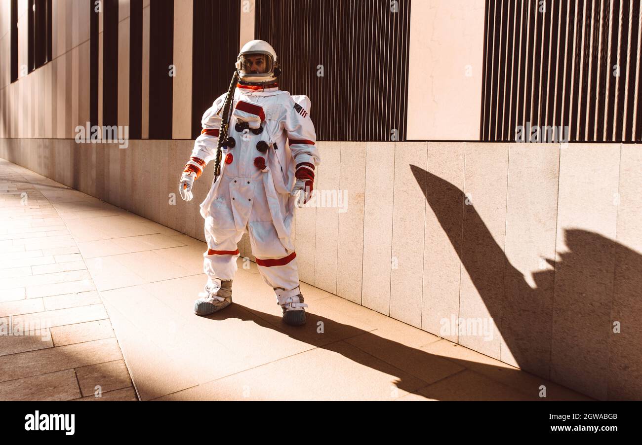 Spaceman in a futuristic station. Man with space suit walking in an ...