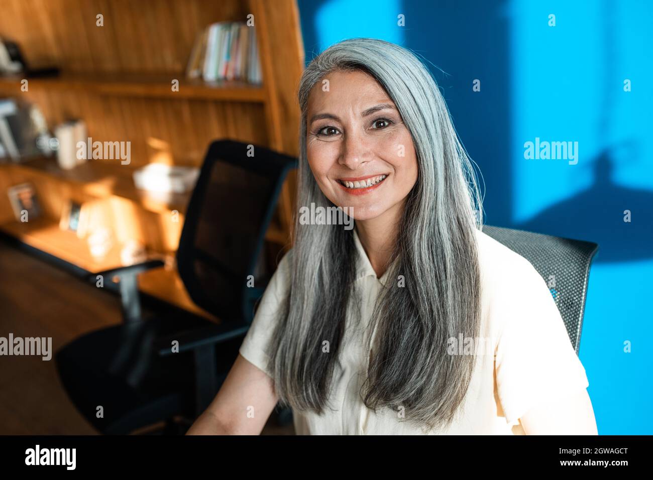 cinematic image of a senior business woman. Portrait of an employee in ...
