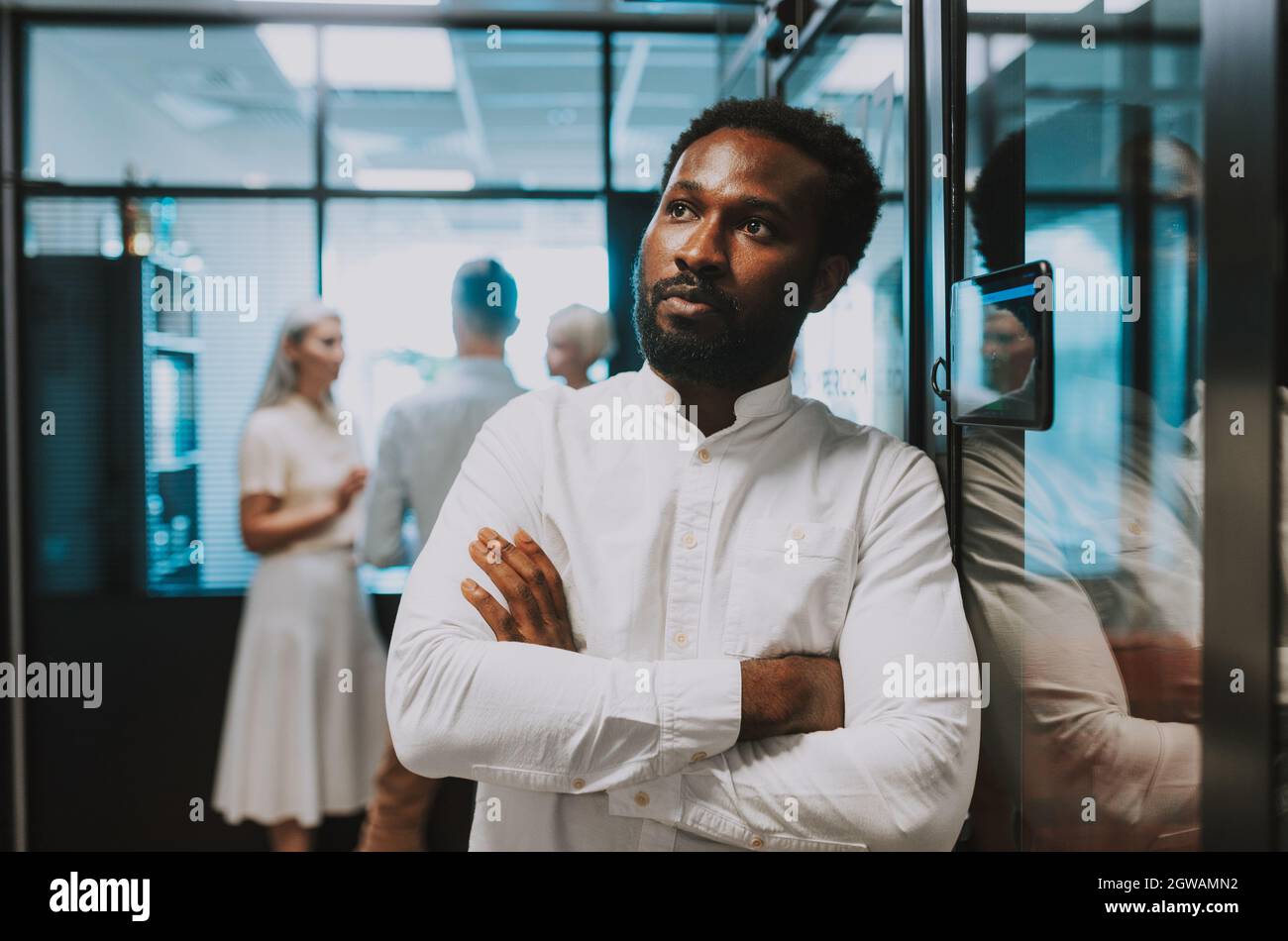 cinematic image of a multiethnic business team. employees speaking ...