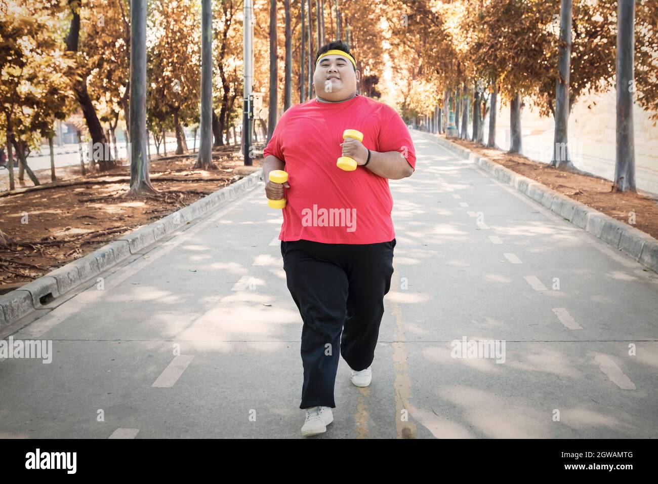 Fat Man Running High Resolution Stock Photography and Images - Alamy