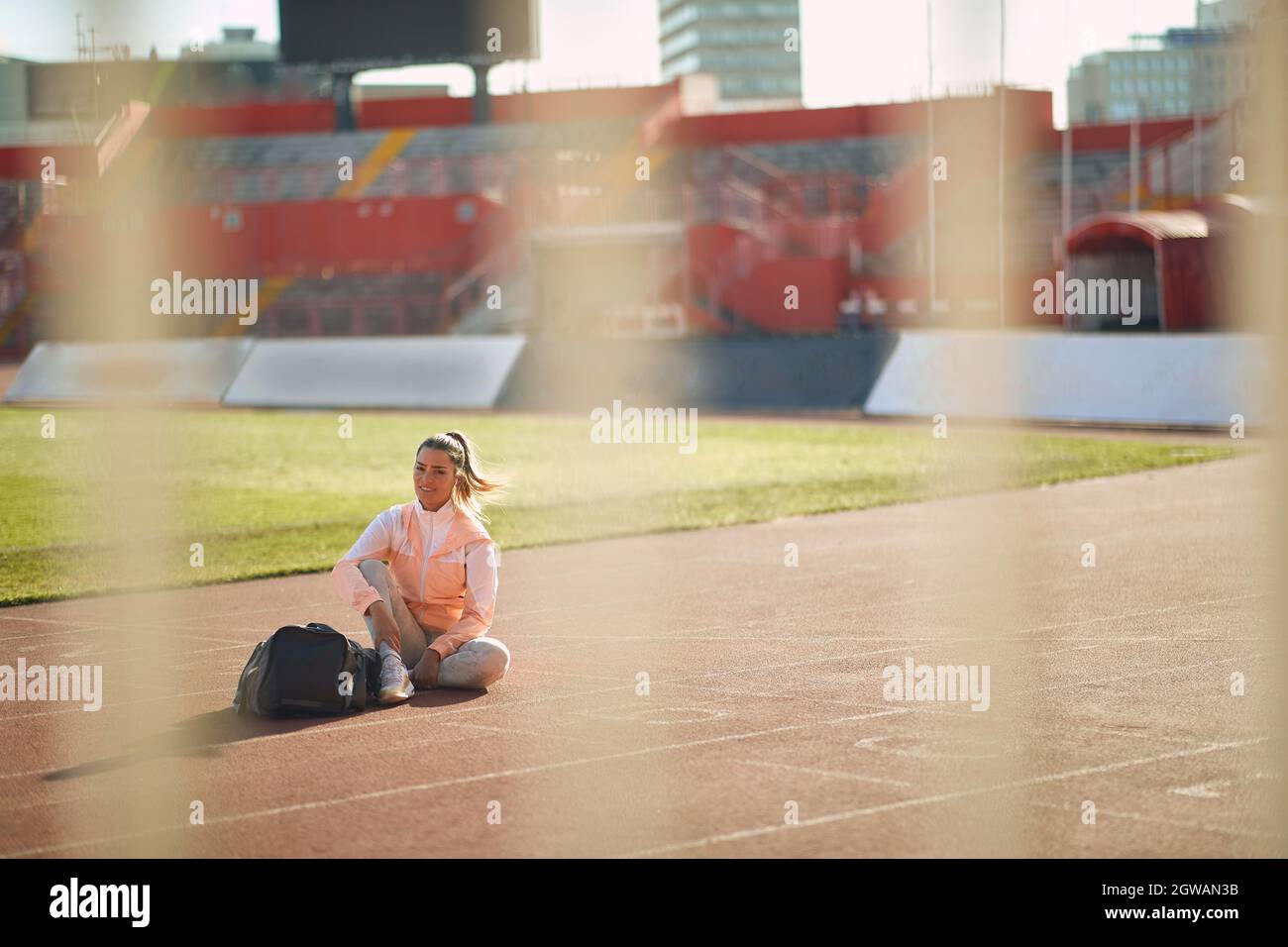 Professional female athlete training for the race on the stadium Stock ...