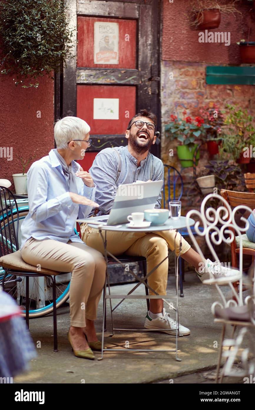 Explaining something funny hi-res stock photography and images - Alamy