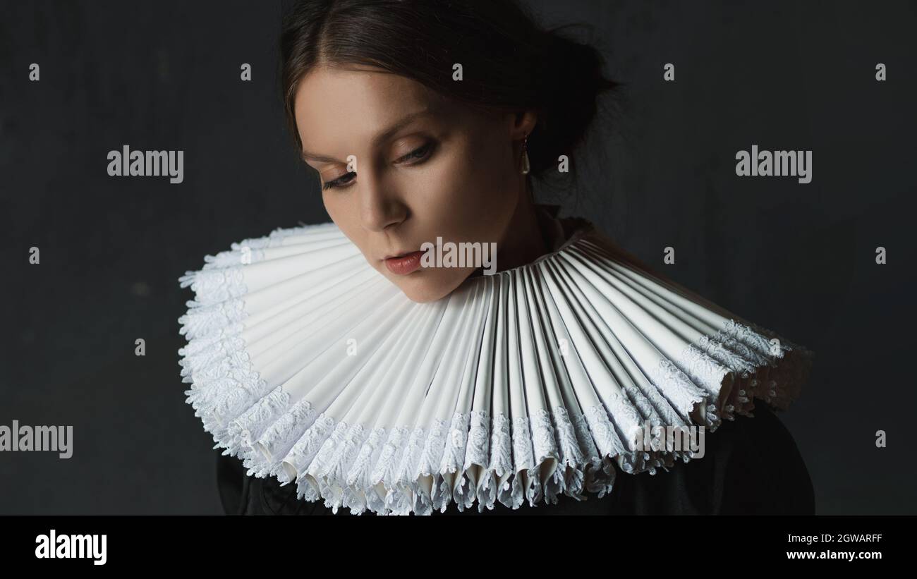 A noble lady in a medieval costume, a young woman in a round Spanish ...
