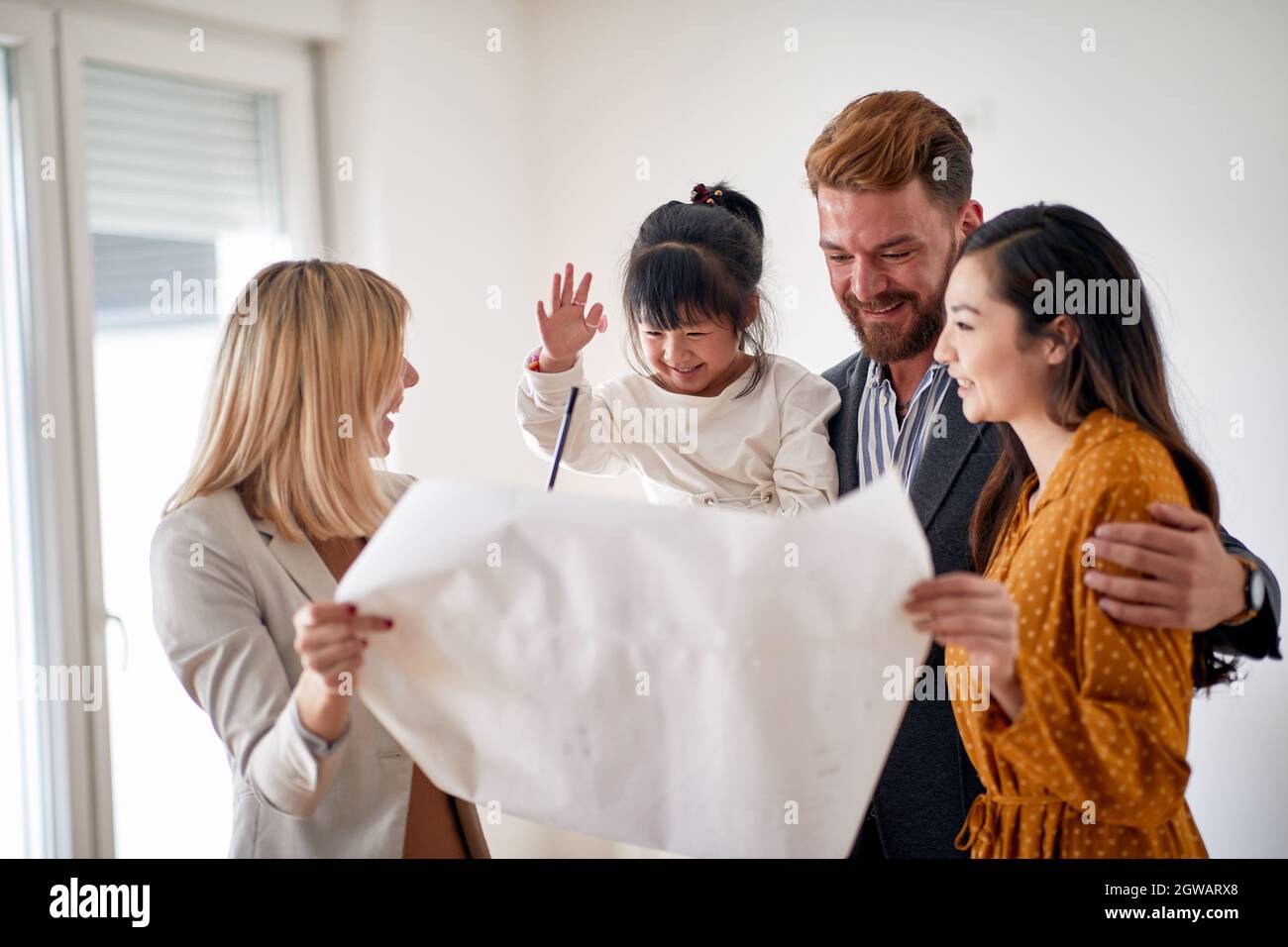 Lovely multi ethnic family searching for new home together; New ...