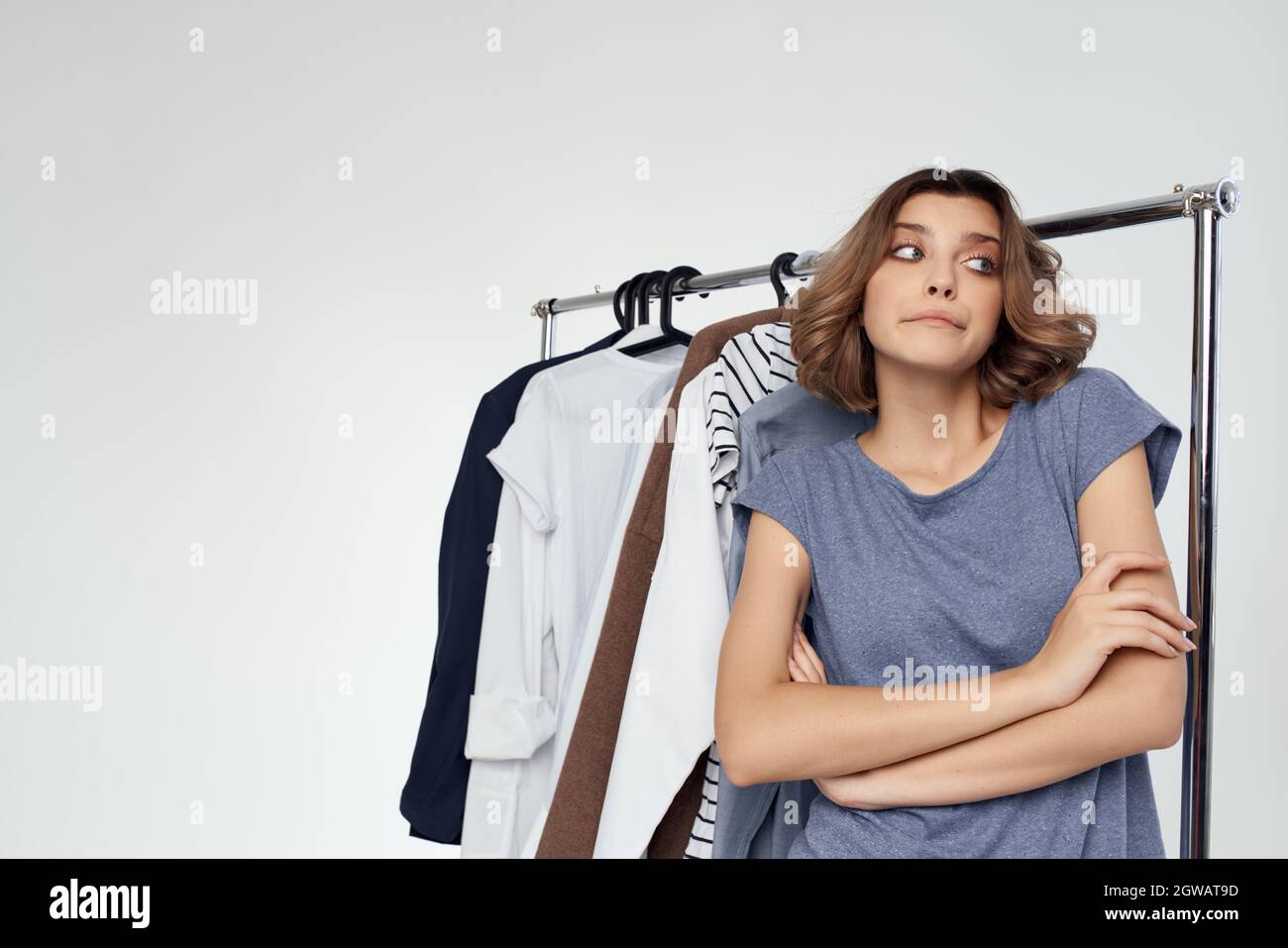 pretty woman clothing store buyer sale light background Stock Photo - Alamy