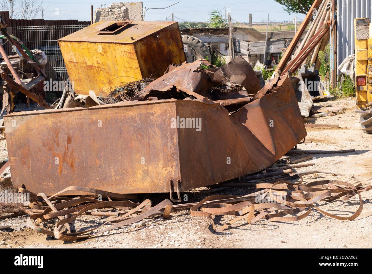 A metal scrap yard recycling rusty pieces of metal Stock Photo - Alamy
