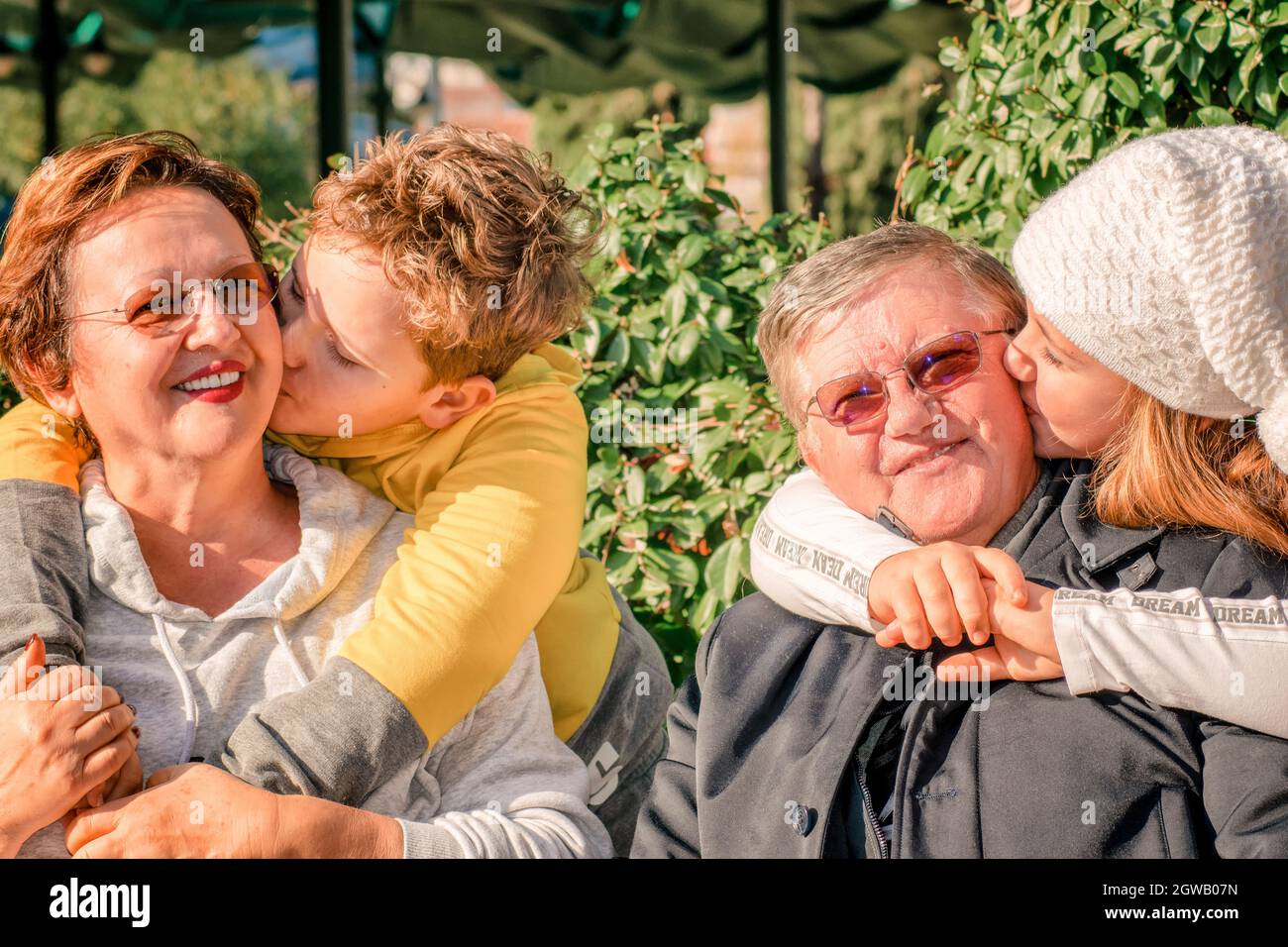 Grandfather hugging girls hi-res stock photography and images - Alamy