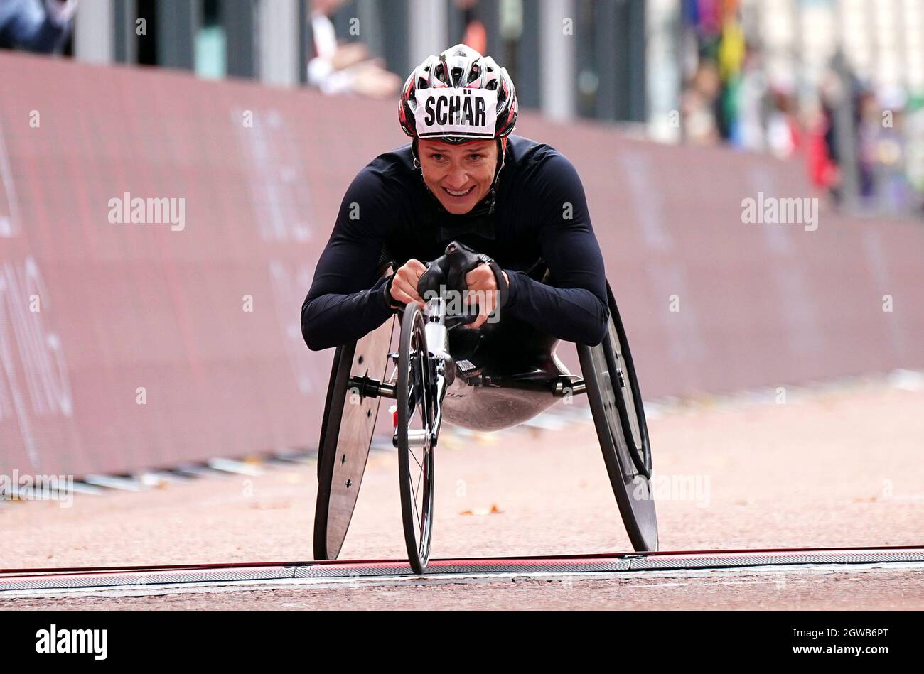 Manuela Schar crosses the line to win the Women’s Wheelchair race ...
