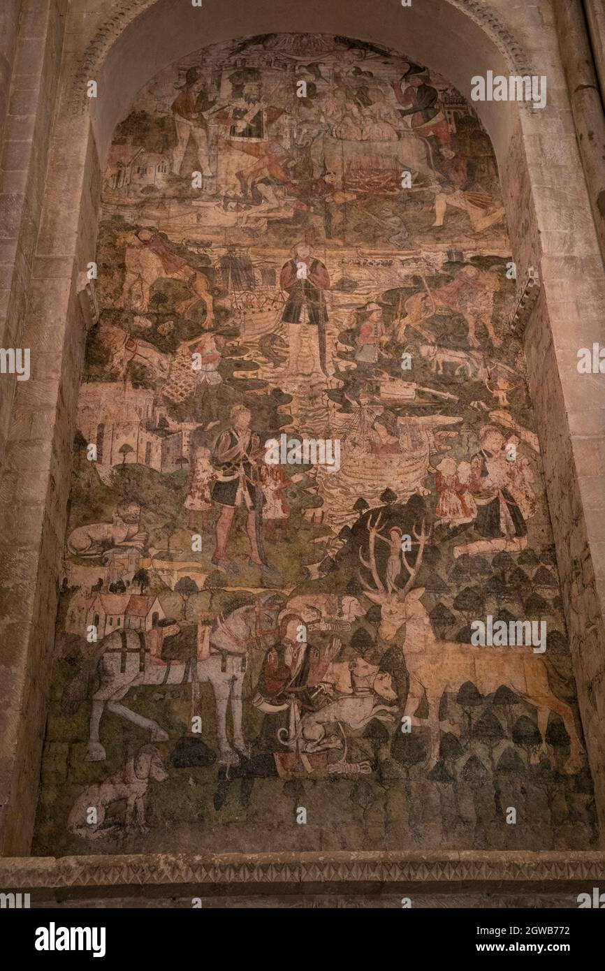 Medieval church wall painting depicting religious scenes in arched ...