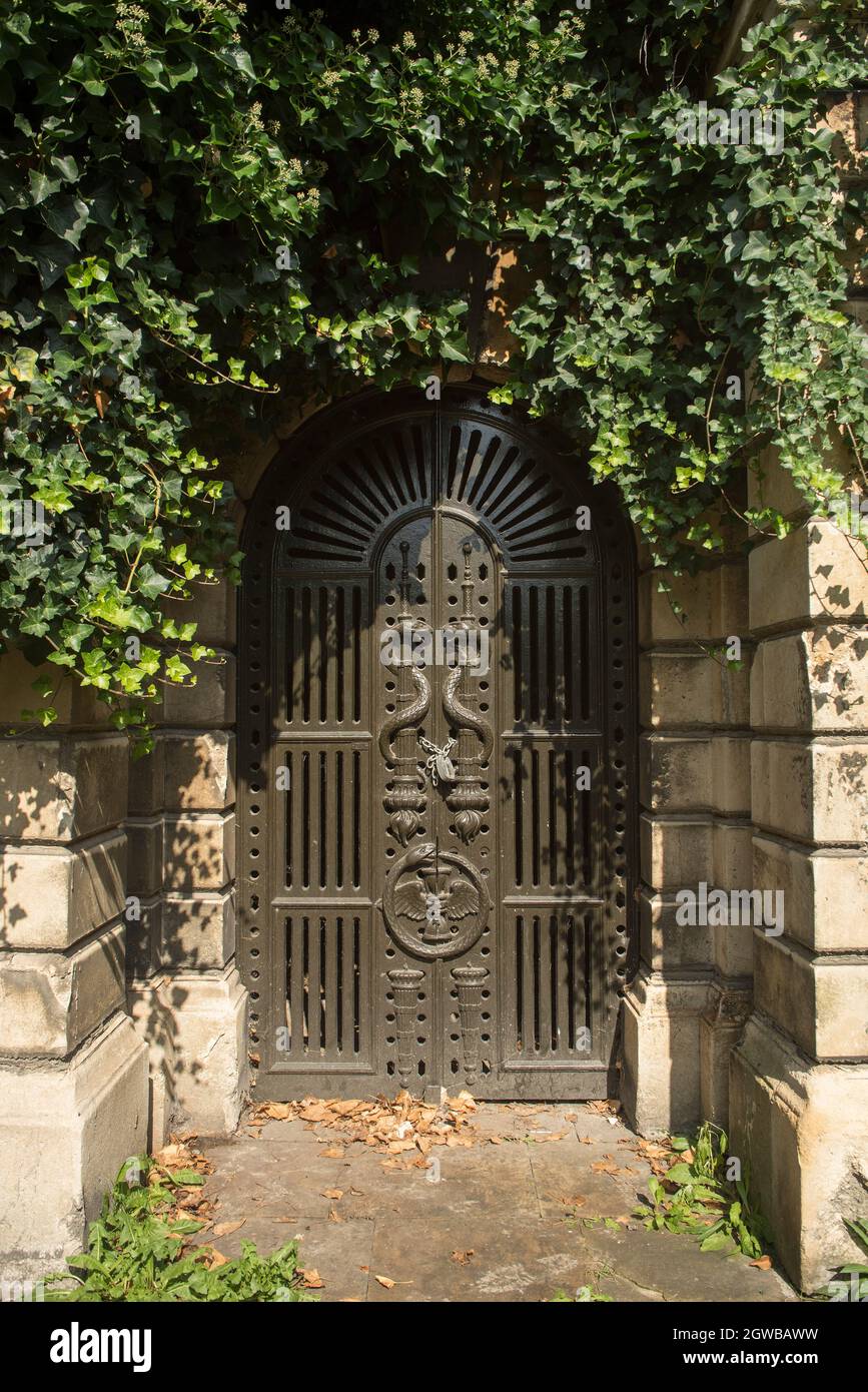 The crypt entrance beneath the colonnades in a Victorian cemetery ...