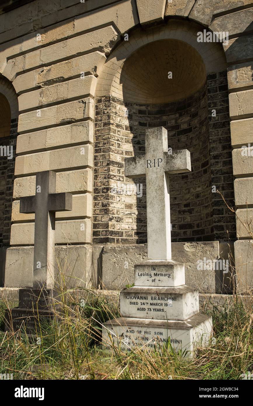Crosses / gravestones behind the colonnades at a Victorian cemetery ...