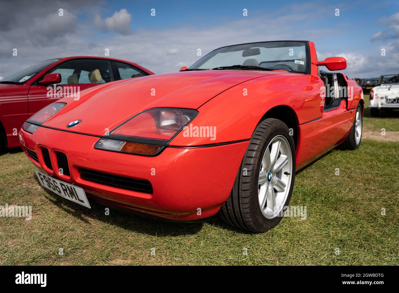 Red BMW Z1 convertible sports car at classic car show on grass field ...