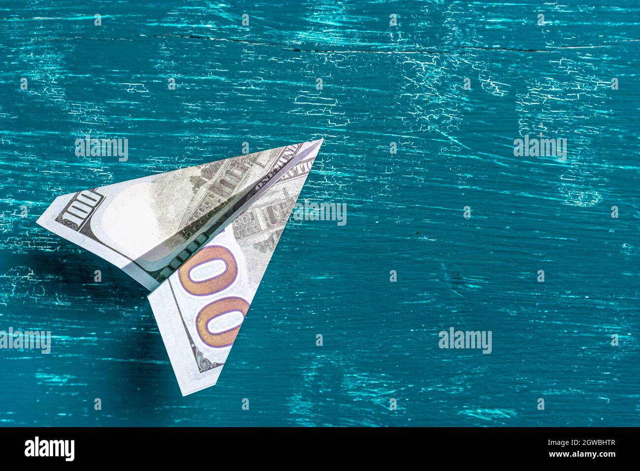 Paper plane. Airplane folded from dollar banknotes Stock Photo - Alamy