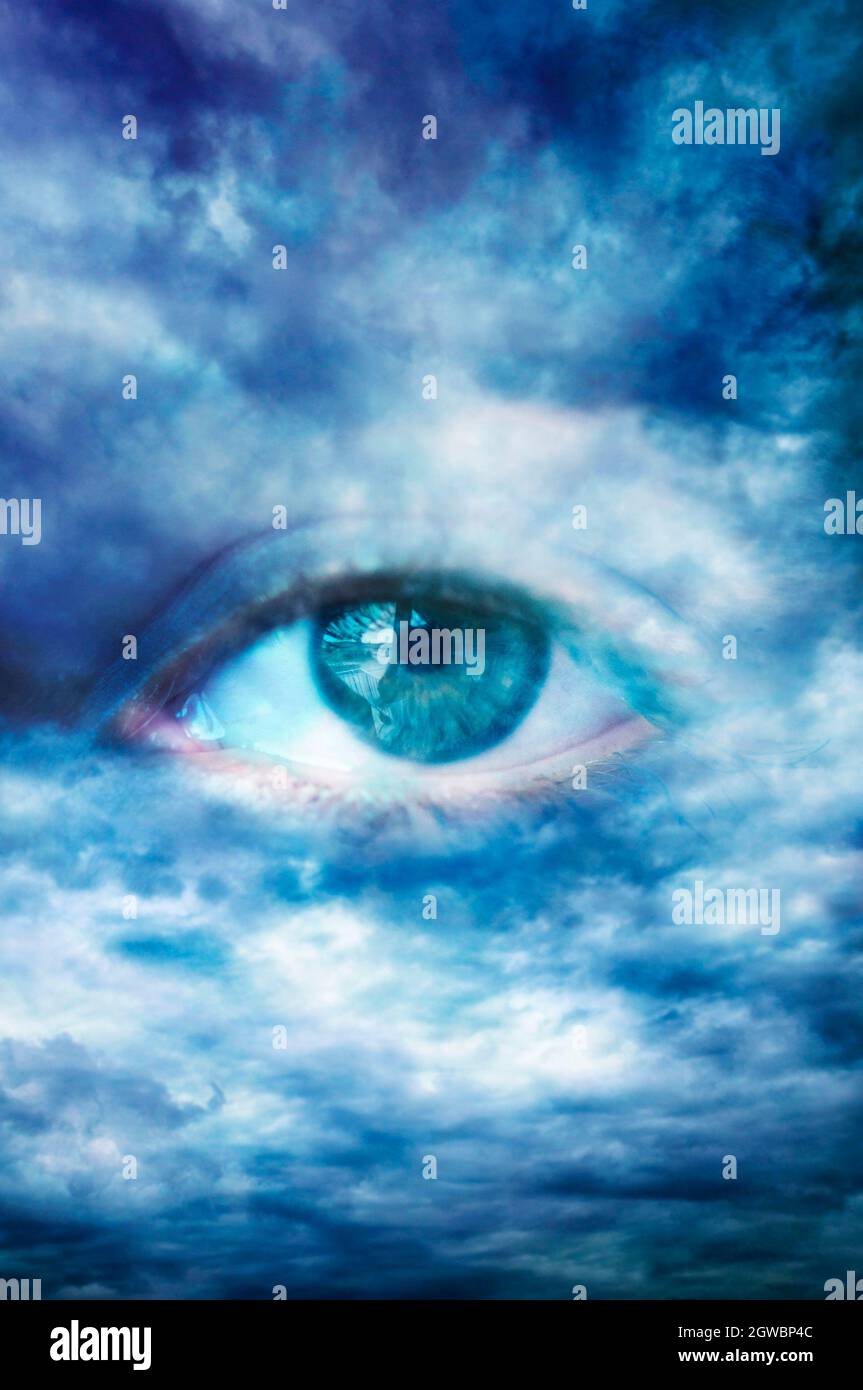 blue eye looking through the clouds Stock Photo - Alamy