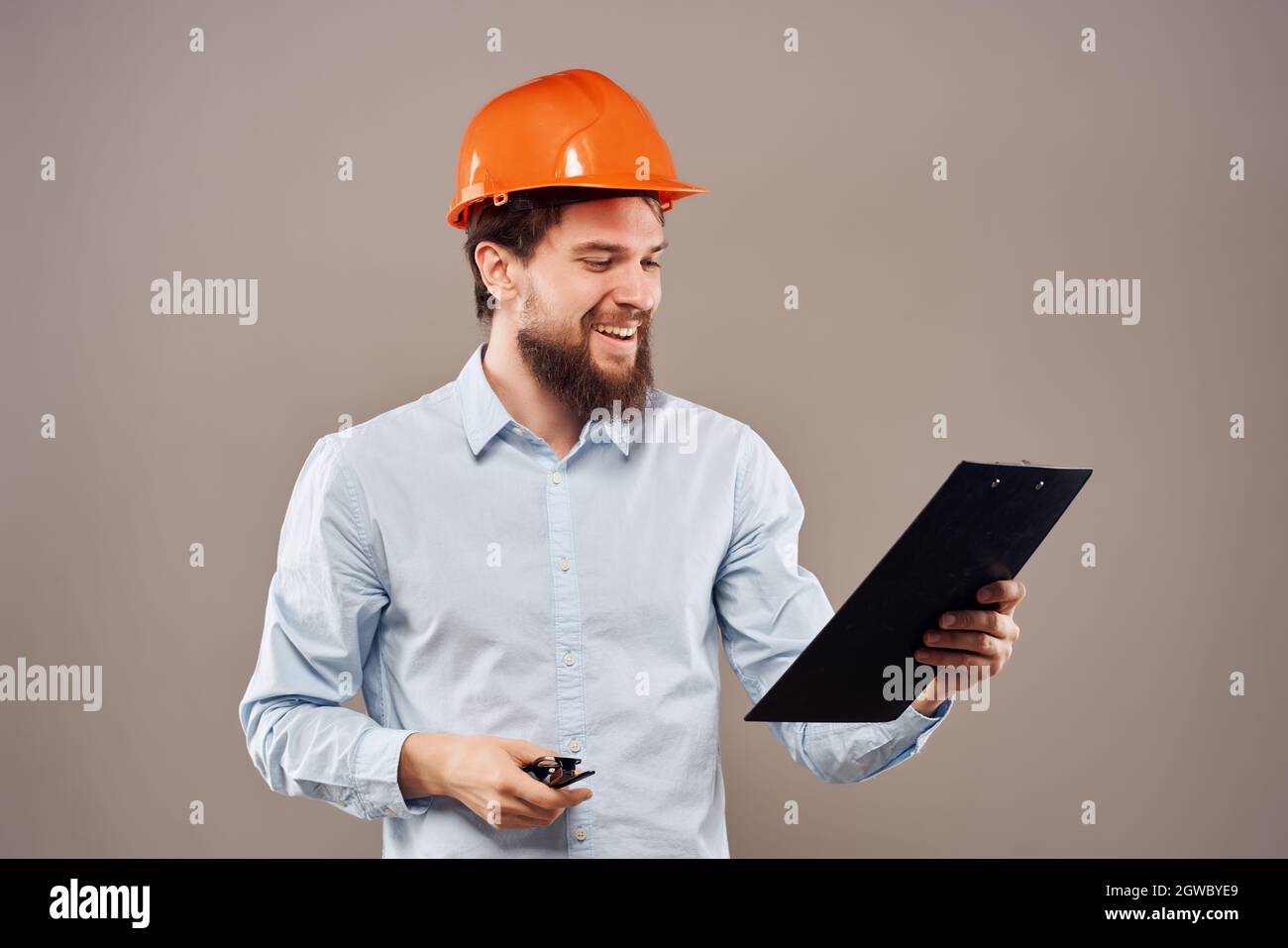 male engineer documents in hand and drawings success isolated ...
