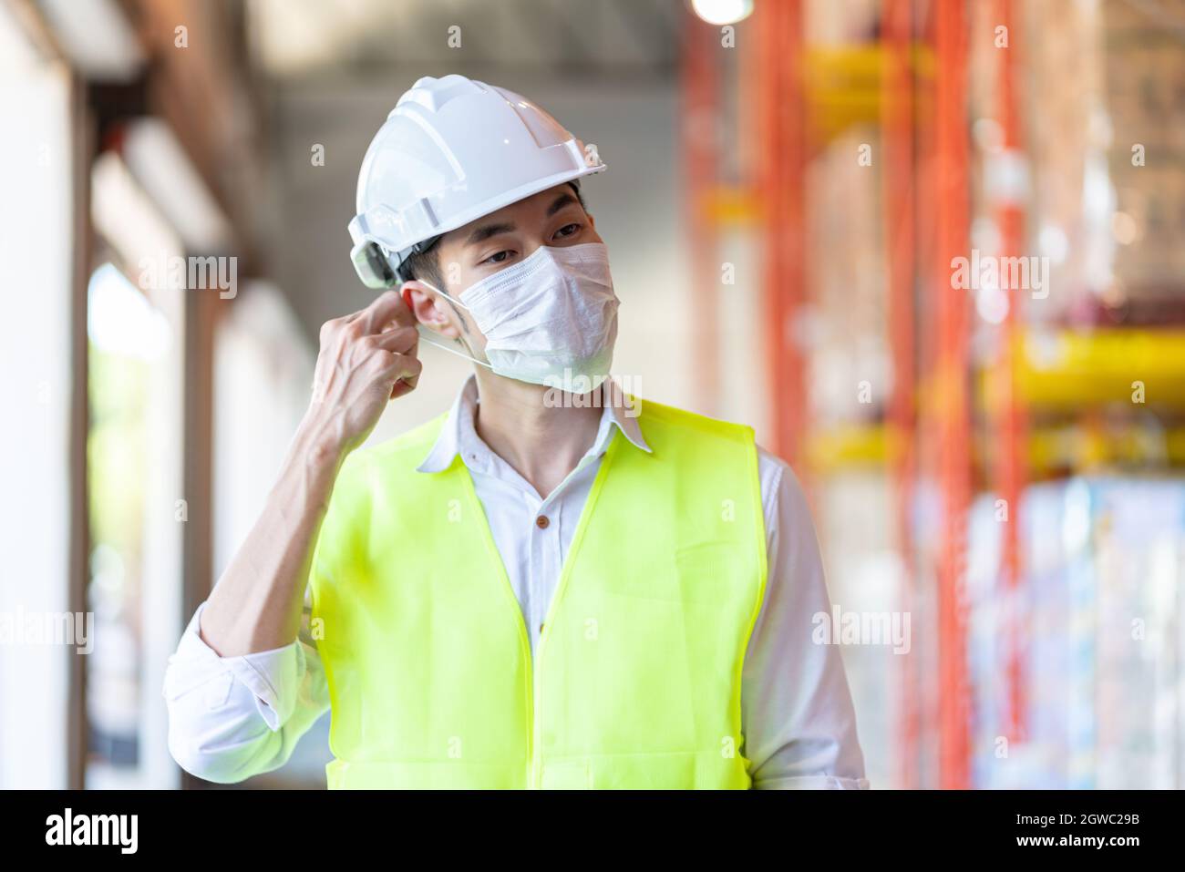 Indian construction worker wearing mask hi-res stock photography and ...