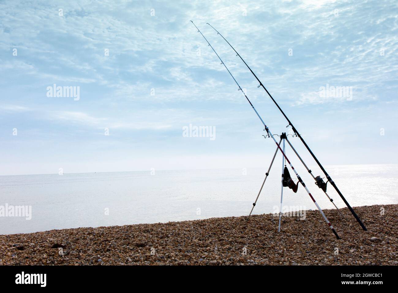 Fishing rods set up on Hurst beach peninsular in Hampshire Stock Photo ...