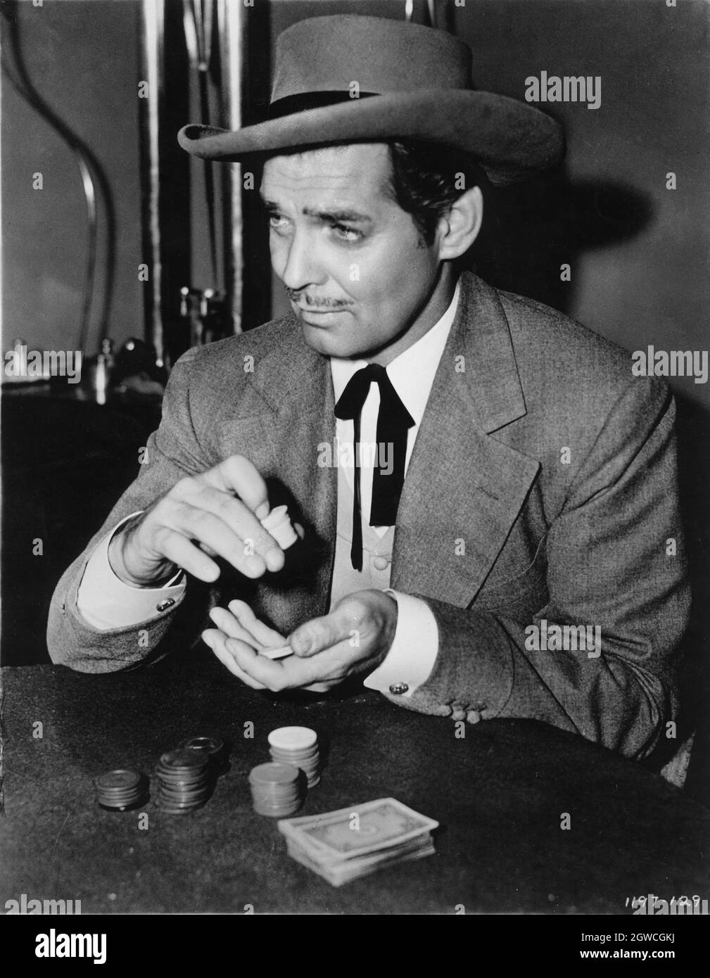CLARK GABLE on set candid portrait with Gambling Chips during filming ...