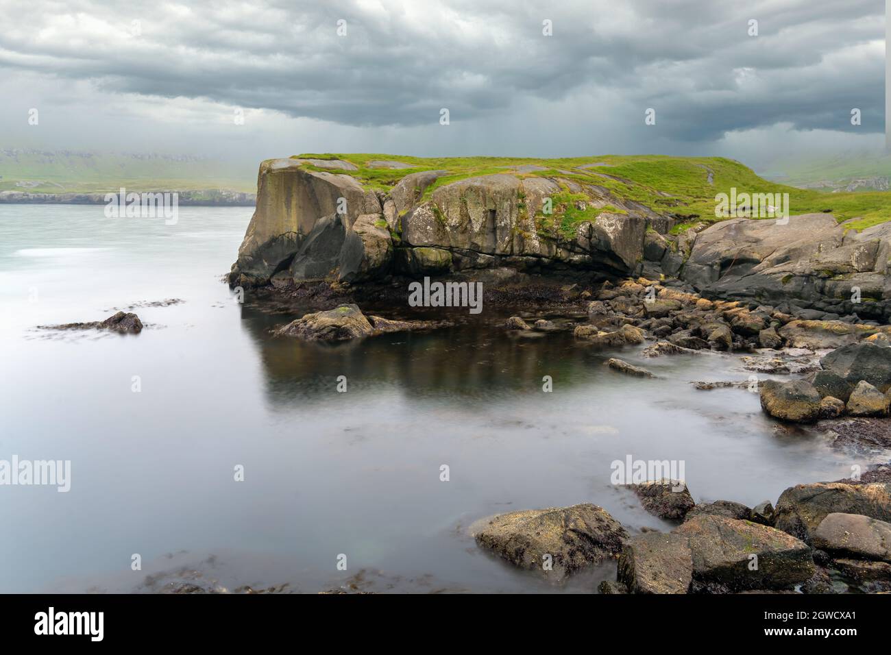 Cliffs near the village of Oyndarfjørður (Andefjord), Eysturoy island ...