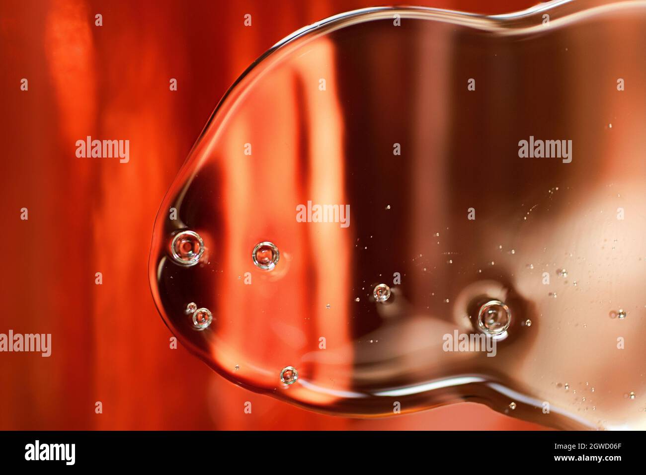 Liquid smear,cosmetics swatch on the metallic background.Top view ...