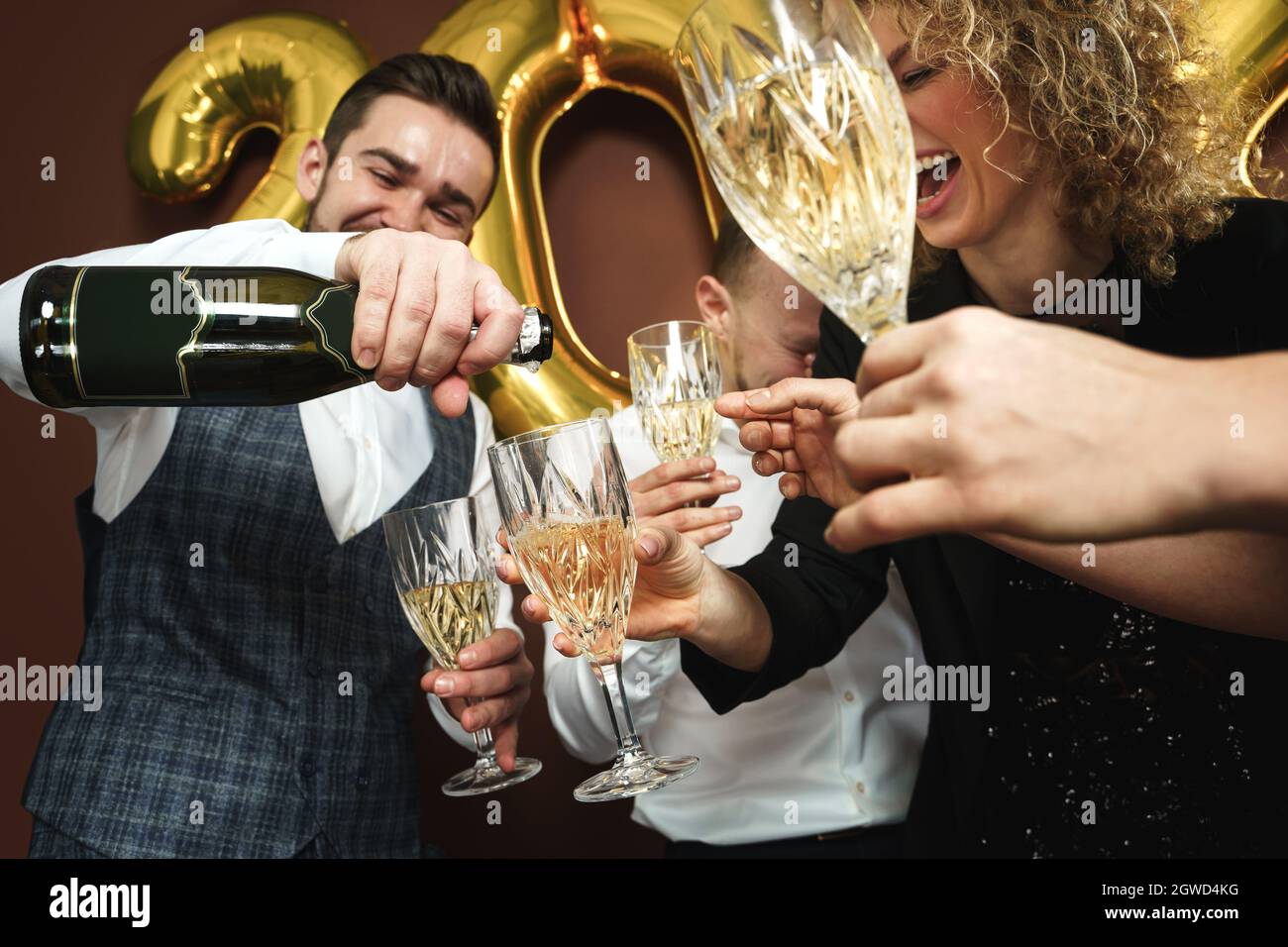 Group of beautiful well dressed party people celebrating New Year and ...