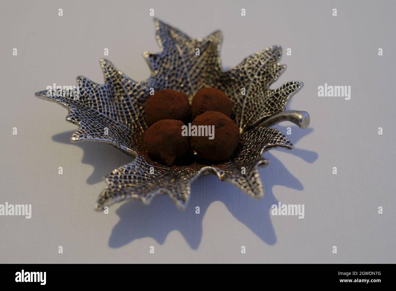 A closeup shot of a chocolate called Triumph in the metal plate which ...