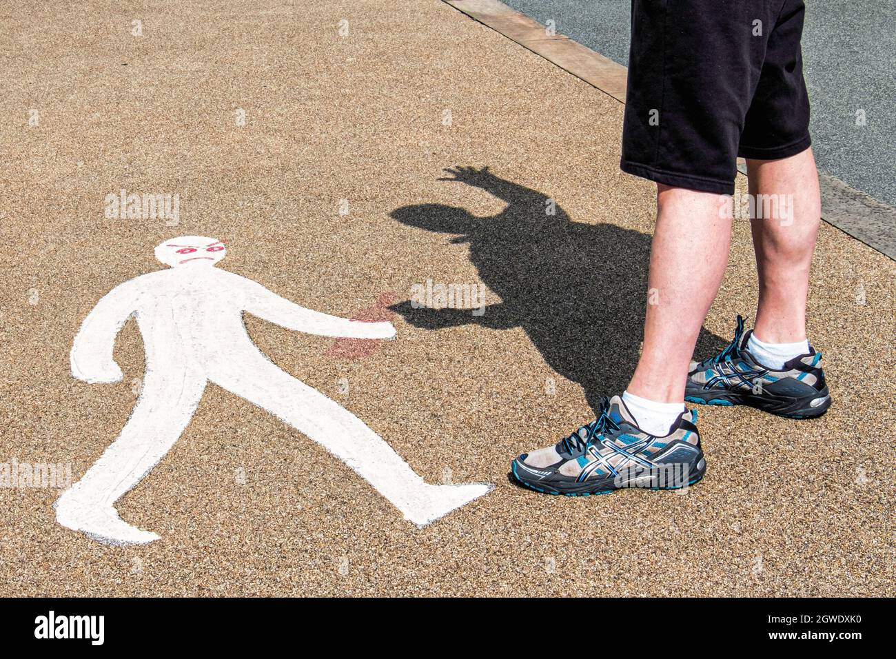 Defaced walking man sign on path next to Thames, Olympian way Greenwich ...