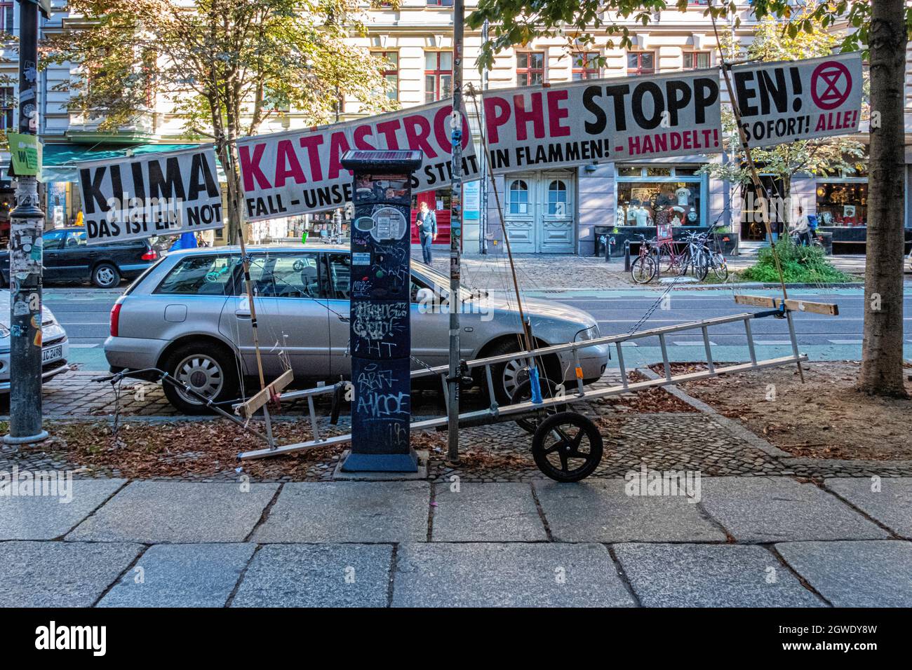 Banner Stop The Climate Catastrophe Climate Change Banner On Pavement In Prenzlauer Berg banner-stop-the-climate-catastrophe-climate-change-banner-on-pavement-in-prenzlauer-berg