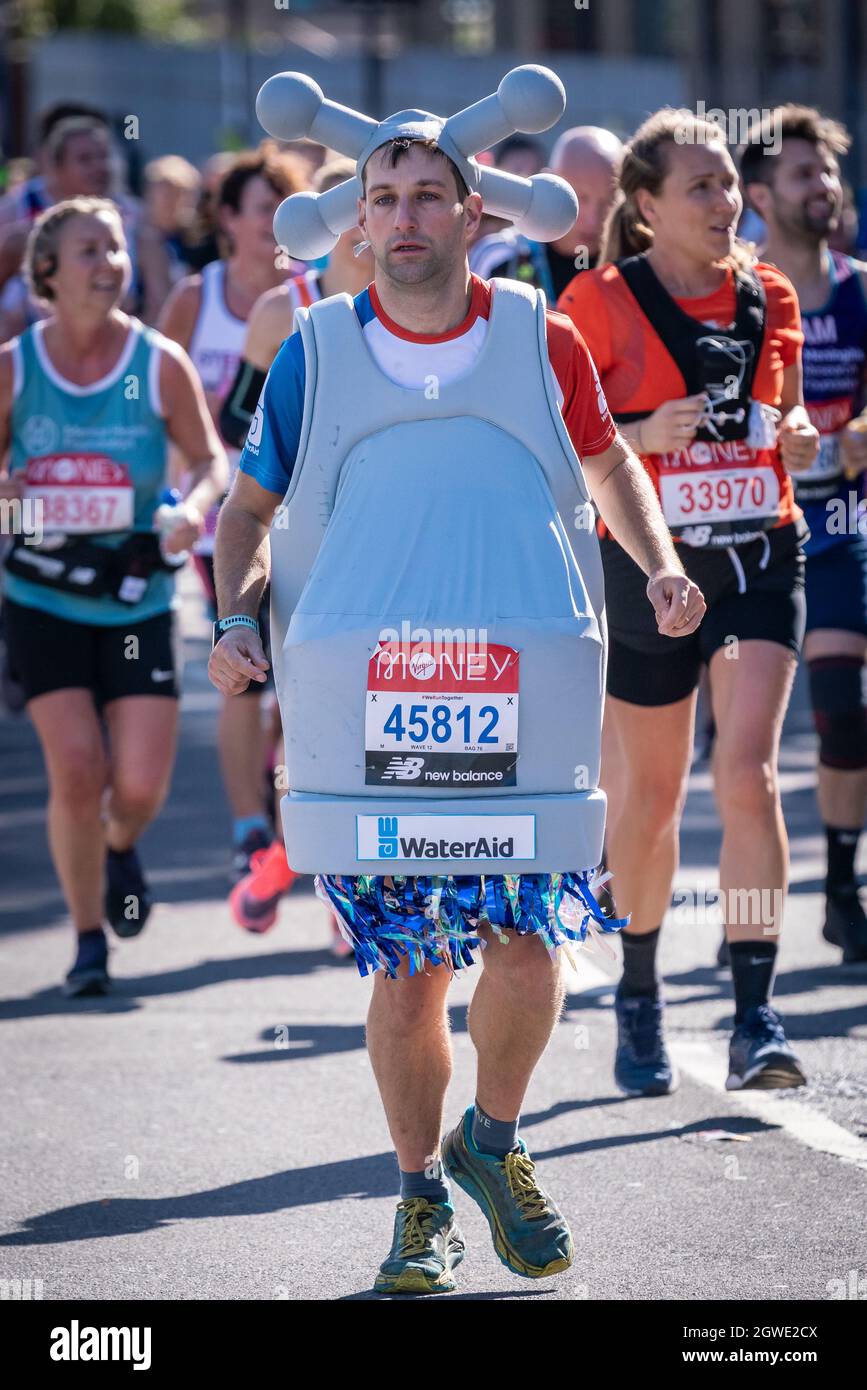 London, UK. 3rd Oct, 2021. Runner dressed as tap for WaterAid charity ...