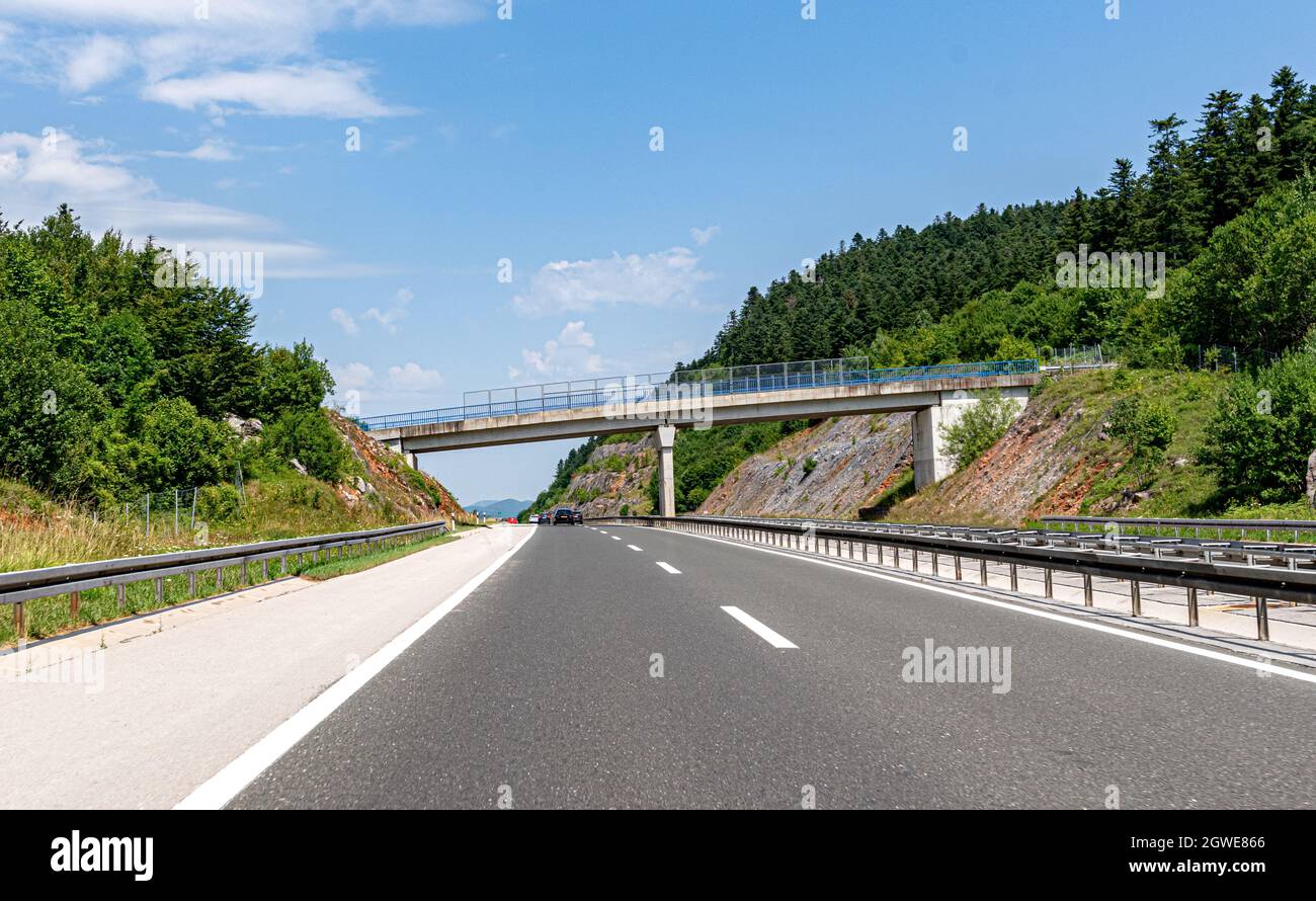 Driving cars on overpass road hi-res stock photography and images - Alamy