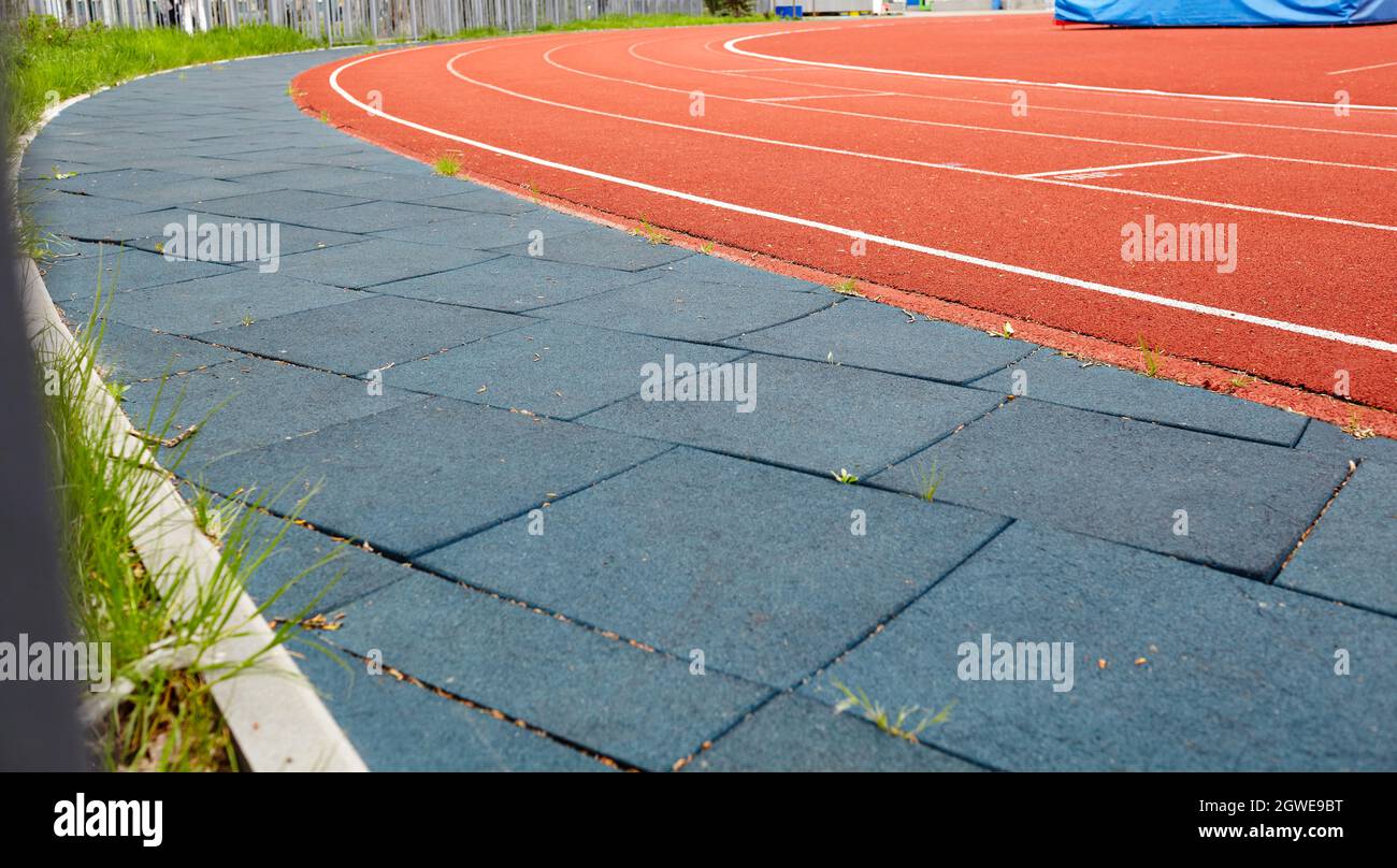 Red treadmill on sport field. Running track on the stadium Stock Photo ...